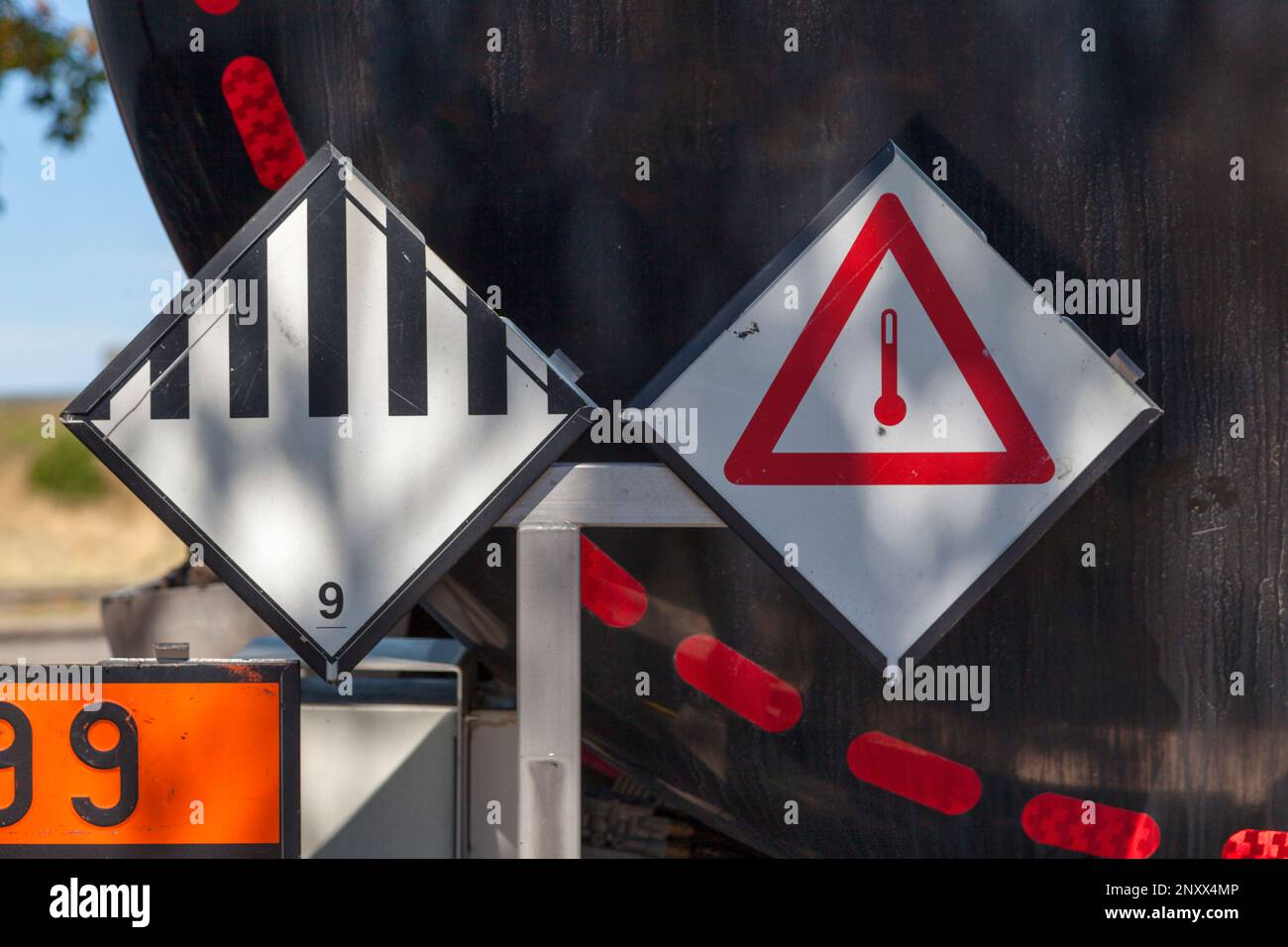 Dangerous goods signs on a tank truck back. The left placard indicate ...
