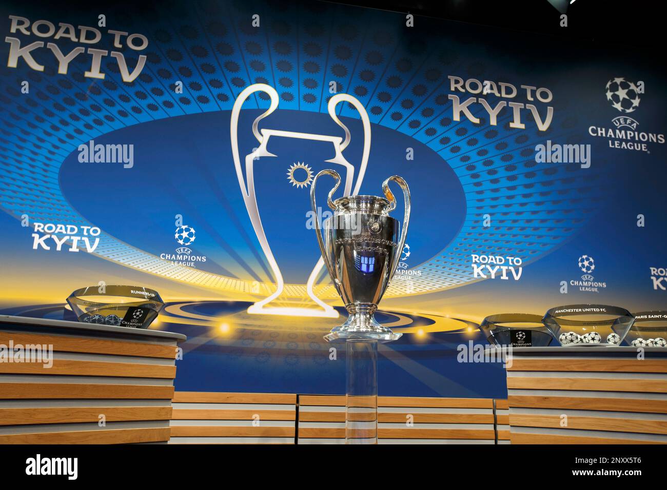 The UEFA Champions League trophy sits on the stage during the drawing ...