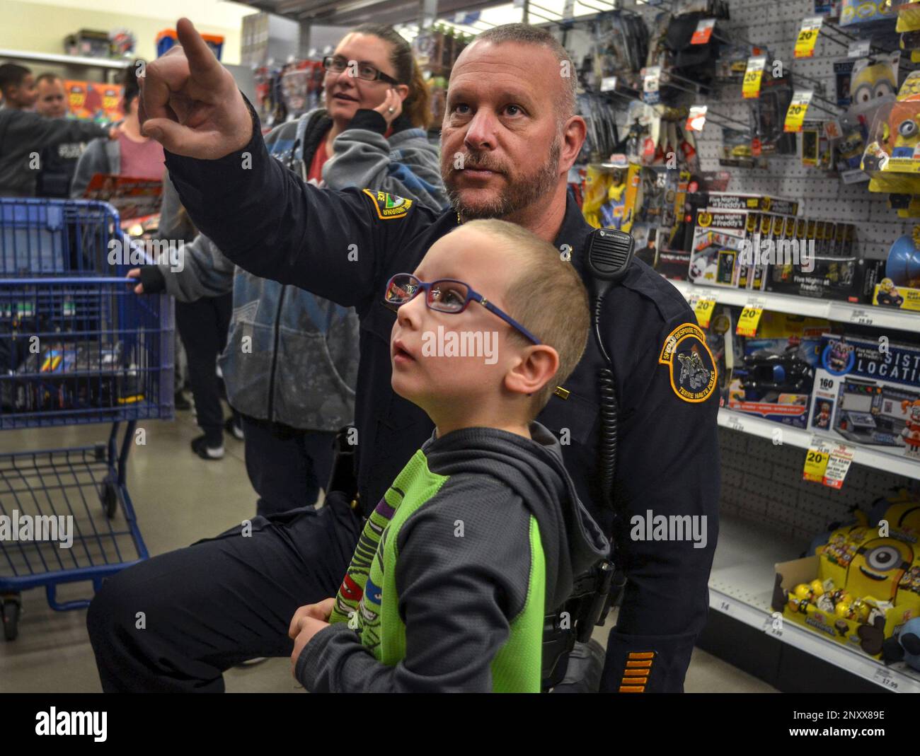 Terre Haute Police Chief John Plasse looks for a remote control car for ...