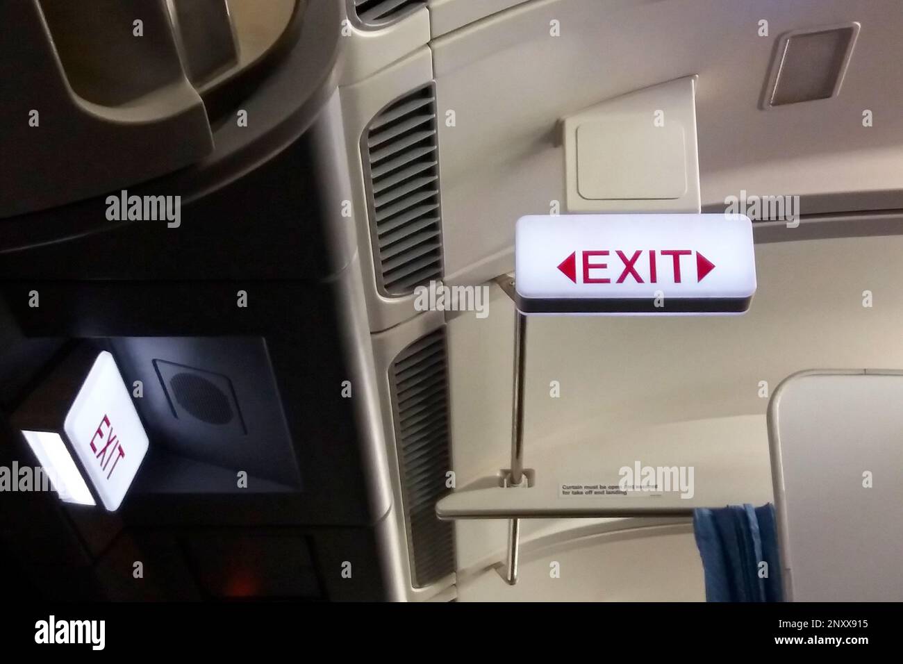 Exit signs inside of an Airbus A330 Stock Photo - Alamy