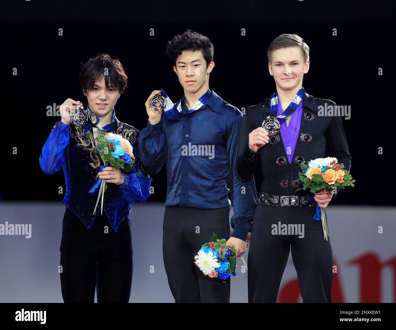 (L-R) Shoma Uno of Japan, silver, Nathan Chen of U.S.A., winner and Mikhail Kolyada of Russia ...
