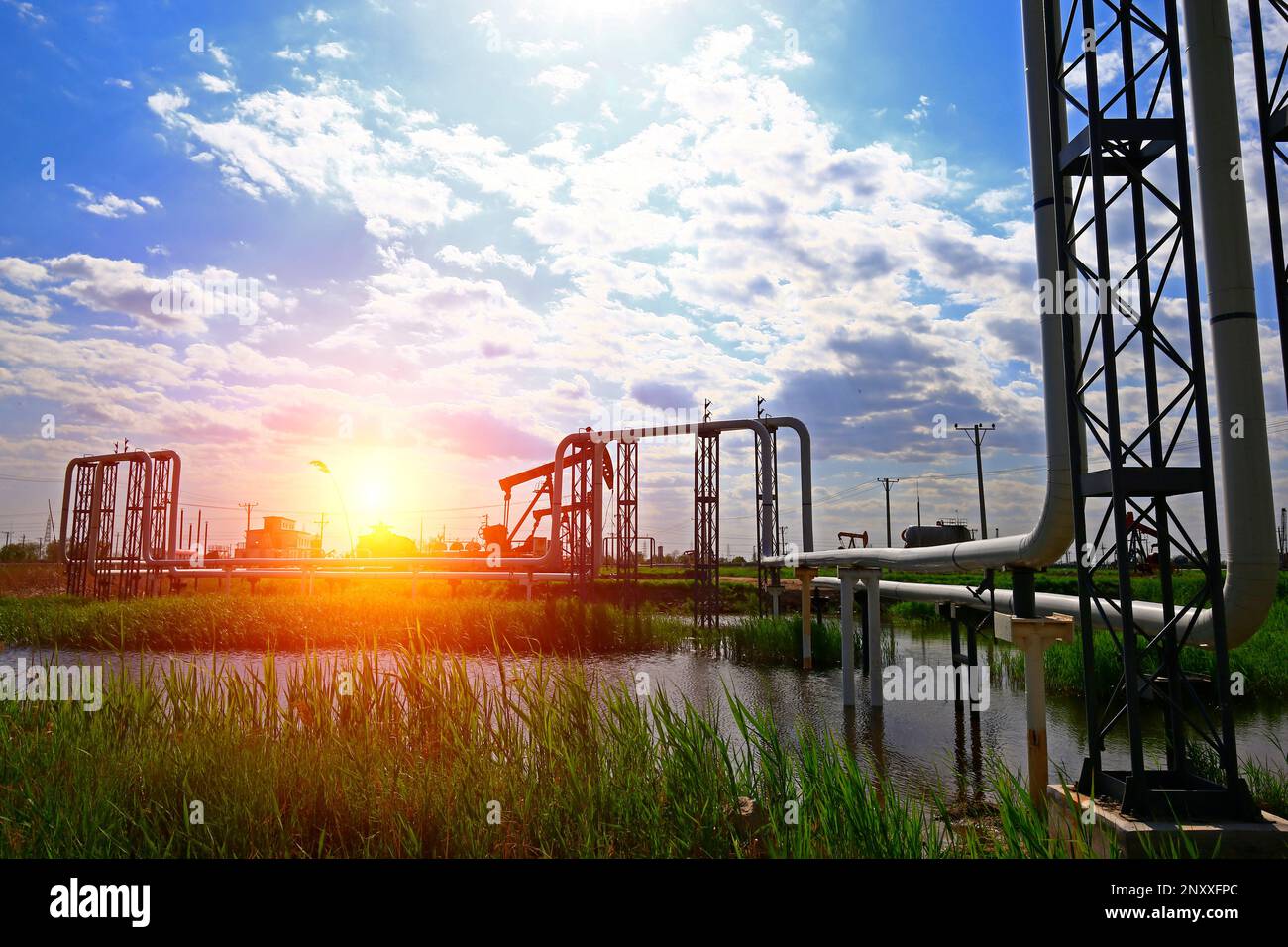 Oil pipes and valves Stock Photo - Alamy