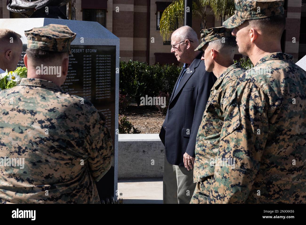 Retired U.S. Marine Col. Clifford Myers reads the names on a Desert ...