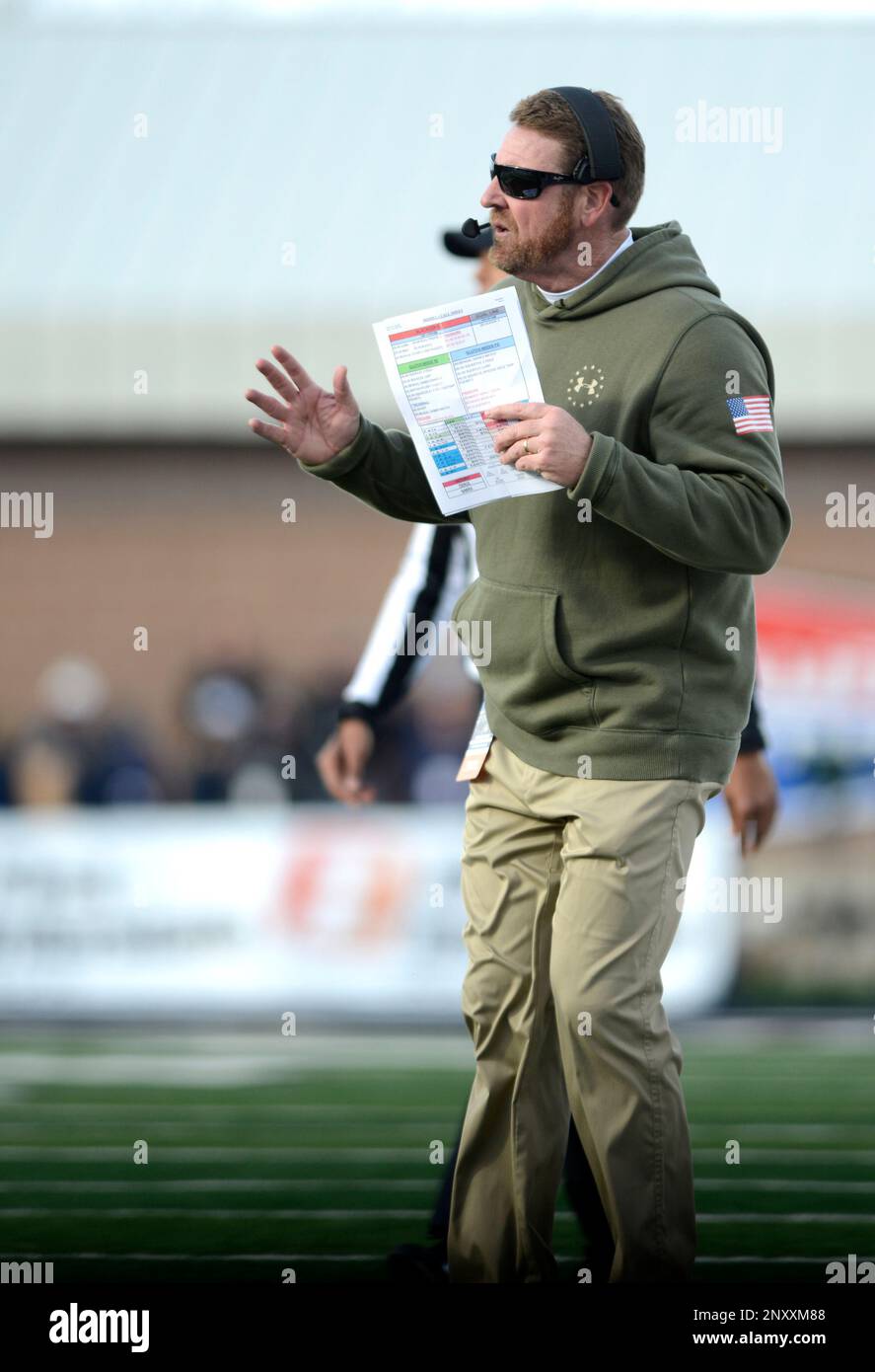 Montana State coach Jeff Choate yells into his headset during an NCAA ...