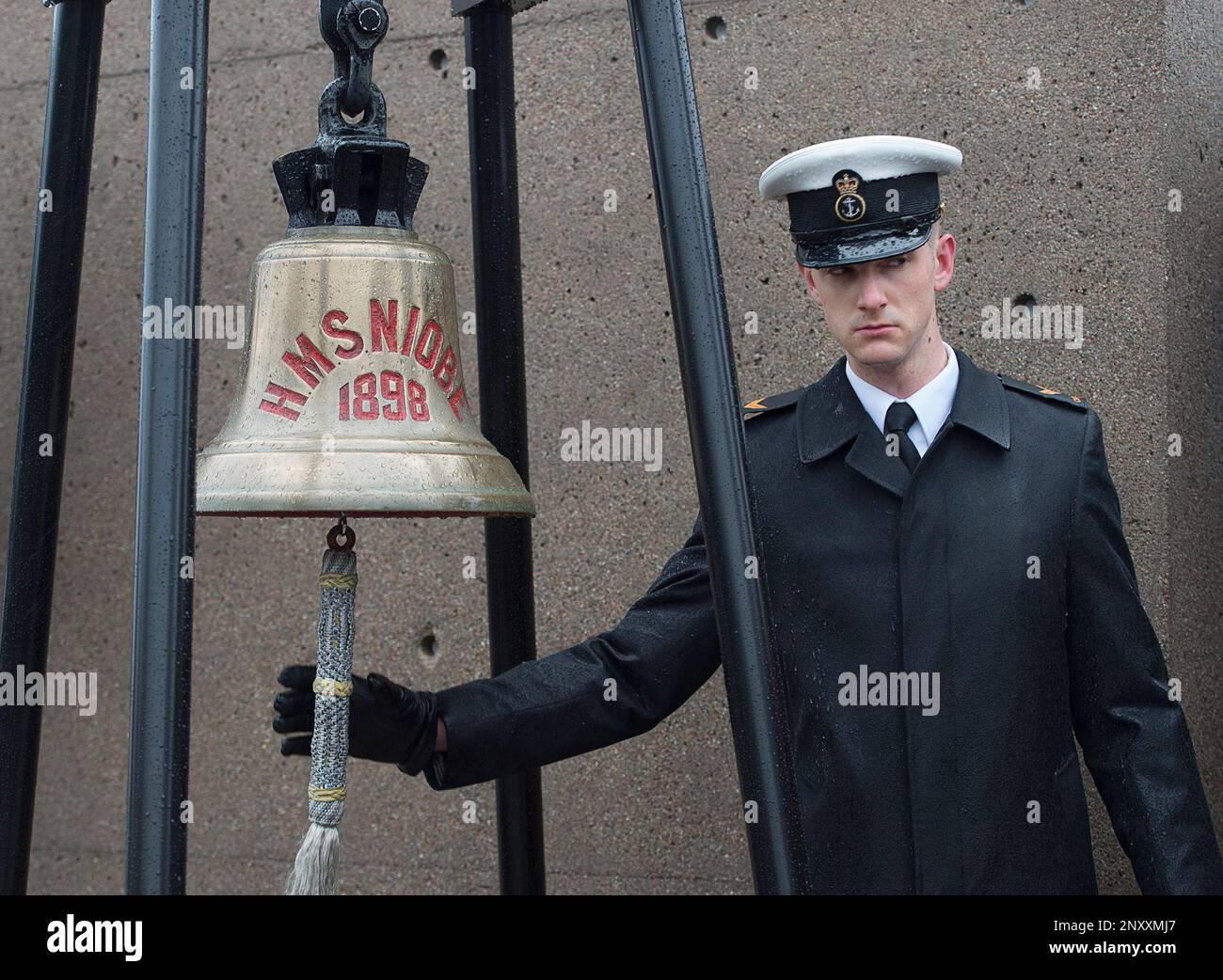 A sailor rings the bell from HMS Niobe at a ceremony to mark the 100th ...