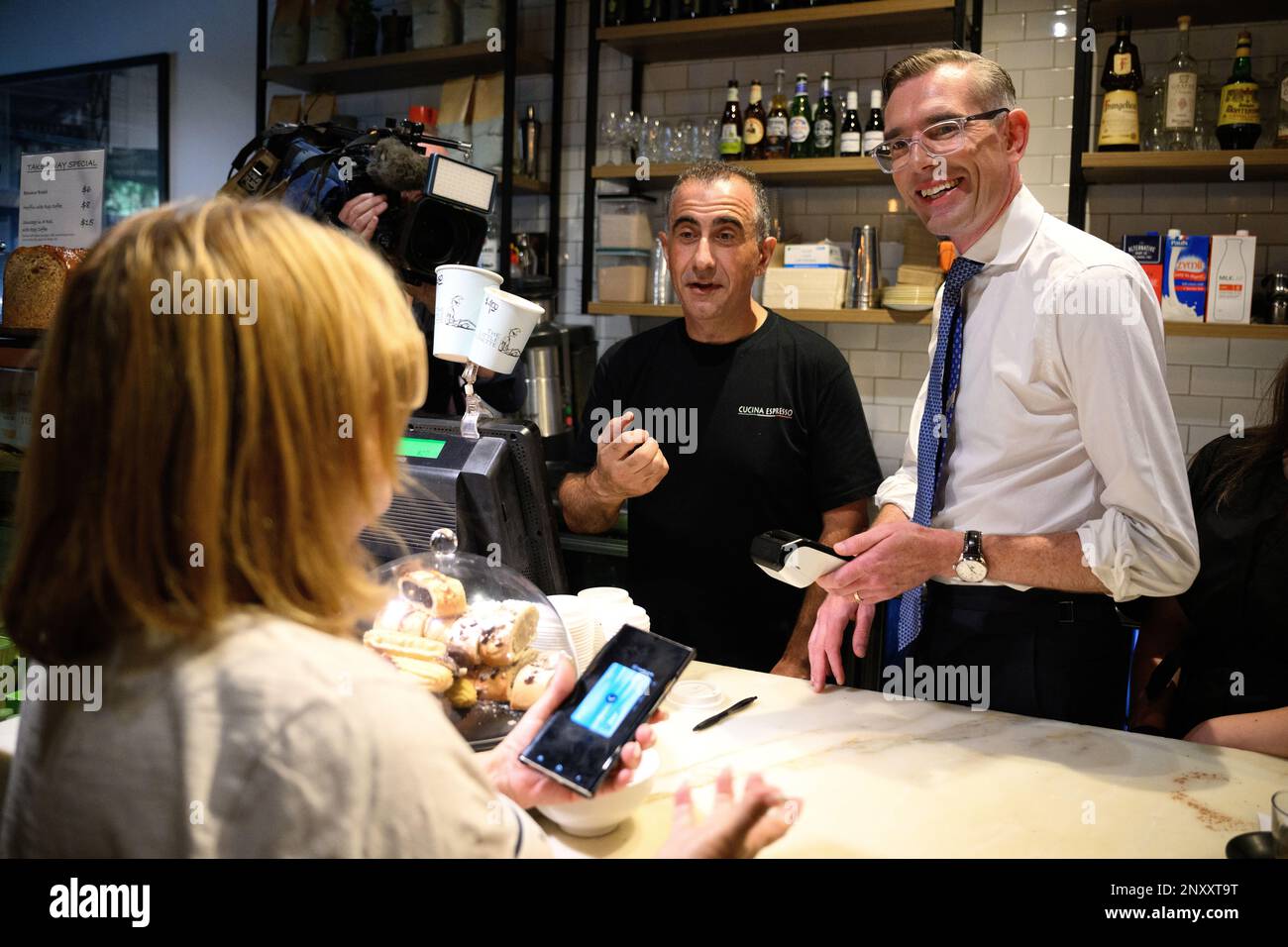 NSW Premier Dominic Perrottet and cafe owner Rocco Calautti during ...