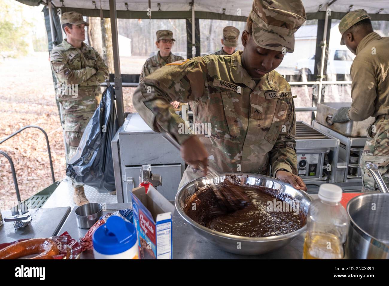 Members of the 375th Quartermaster Company (Field Feeding), HQ, 518th ...
