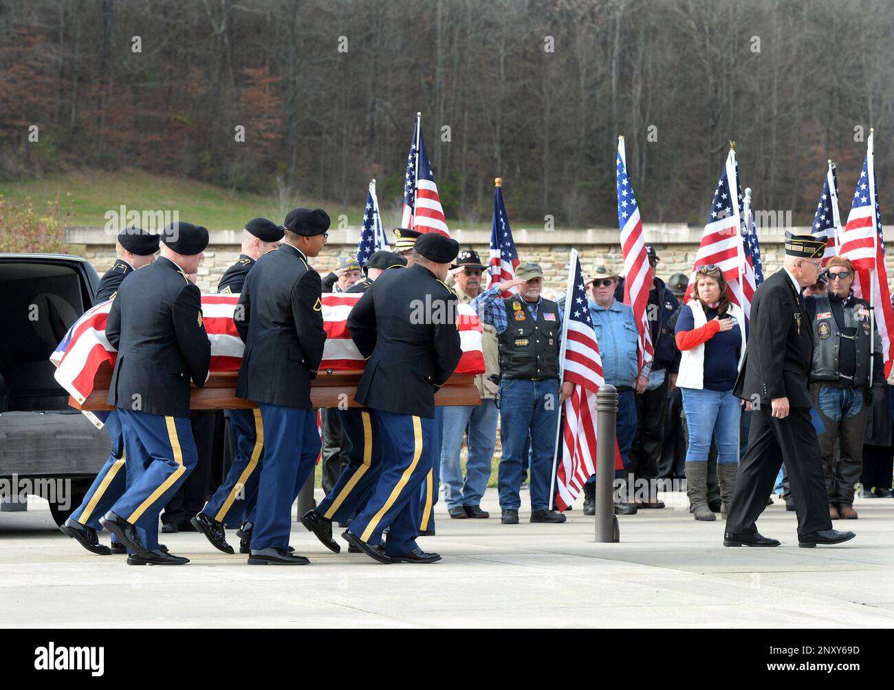 A West Virginia Army National Guard Honor Guard carries a casket with ...
