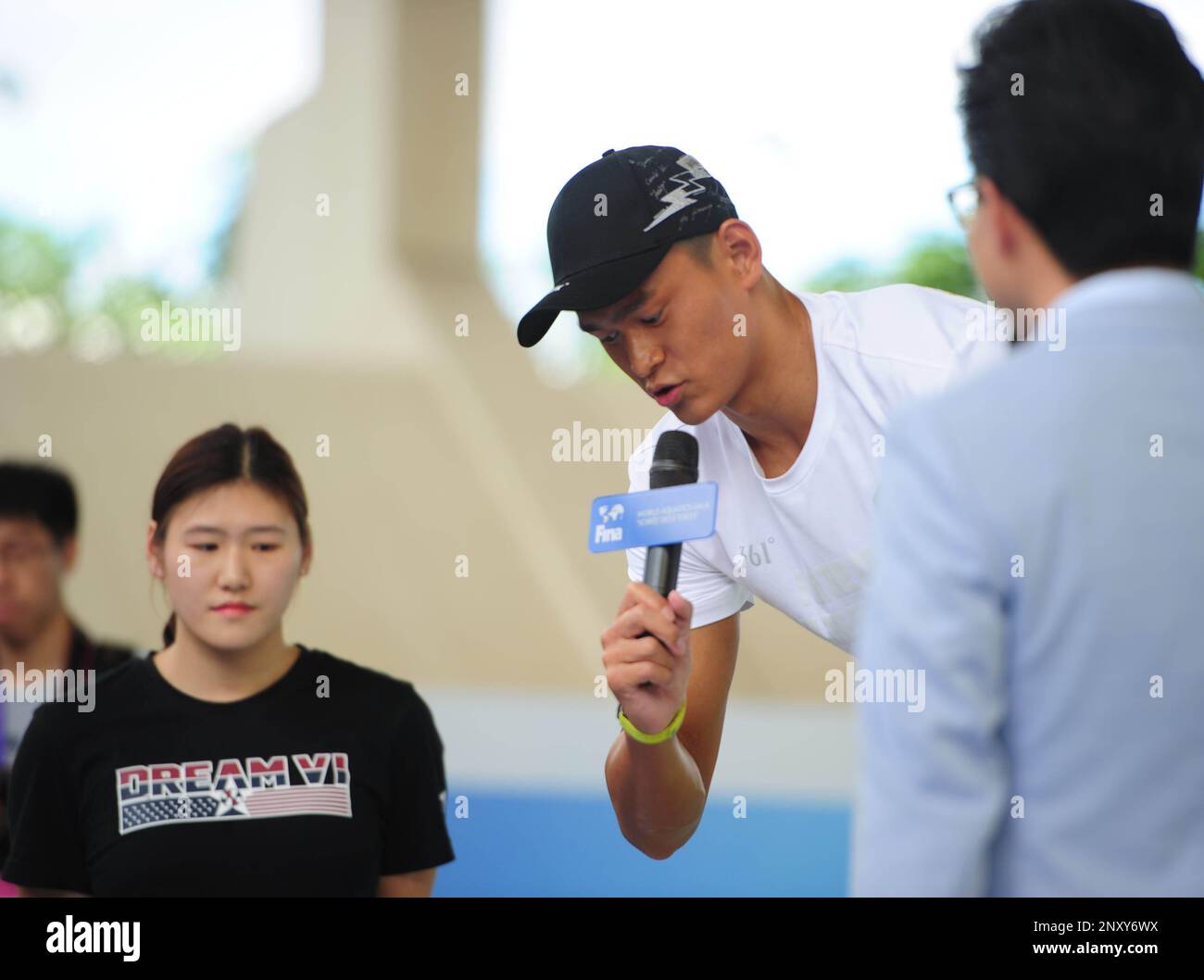 Chinese swimming star Sun Yang attends an open class in a swimming pool ...