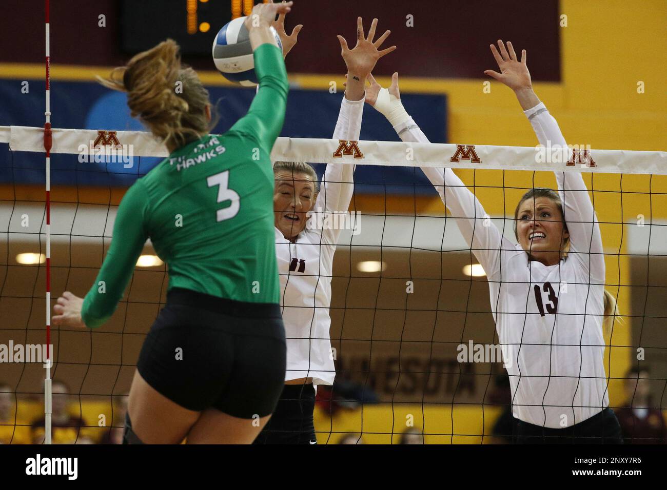 Minnesota setter Samantha Seliger-Swenson (11) and middle blocker Molly ...