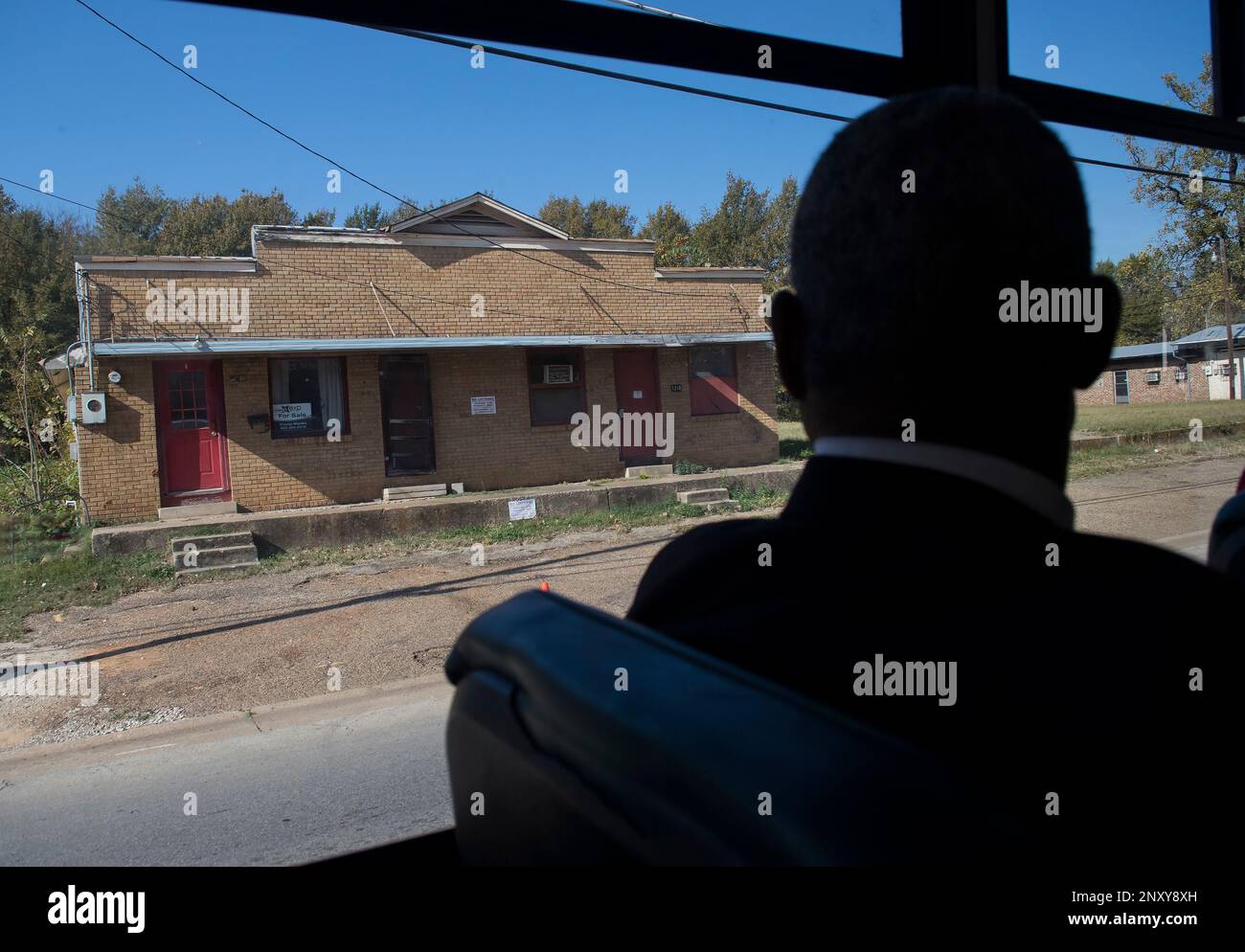 A passenger looks out of the window of the Tyler Transit bus at a ...