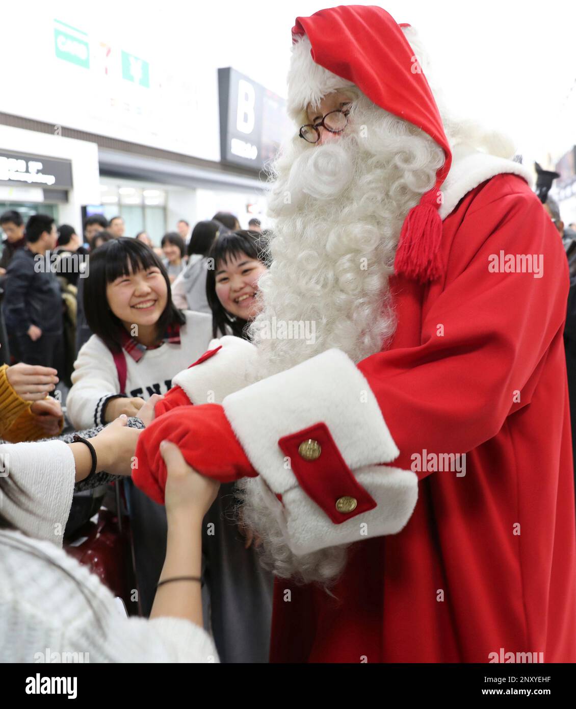 Finland's Santa Clause shakes hands with children after arriving at ...