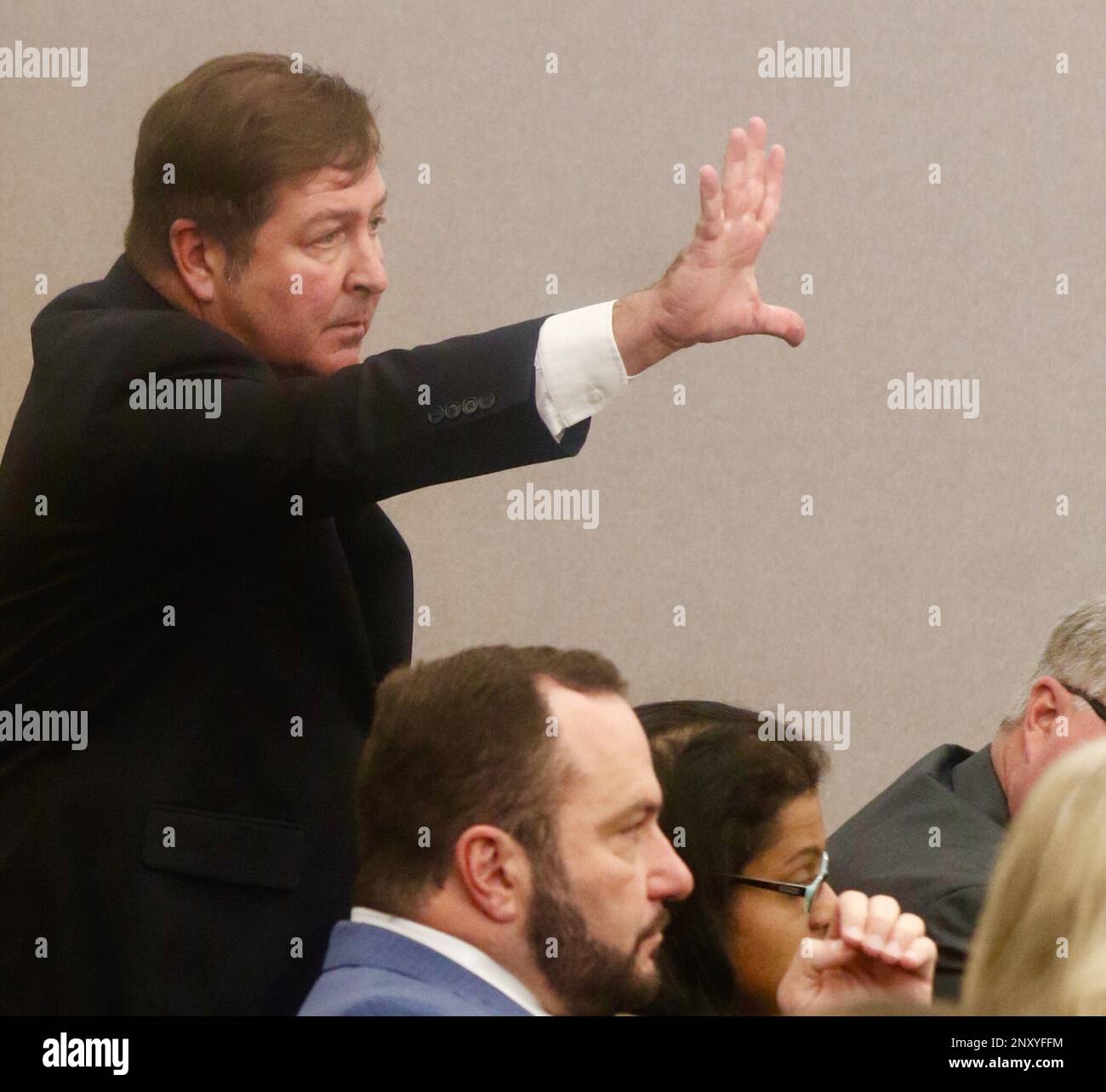 David Kleckner, attorney for Wesley Mathews, father of Sherin Mathews signals his client to take ...