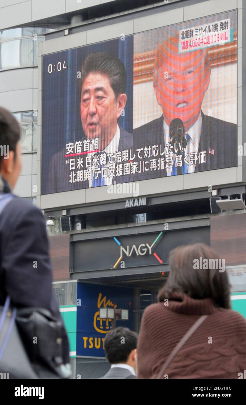 A TV screen on the street broadcasts the news of North Korea's ...