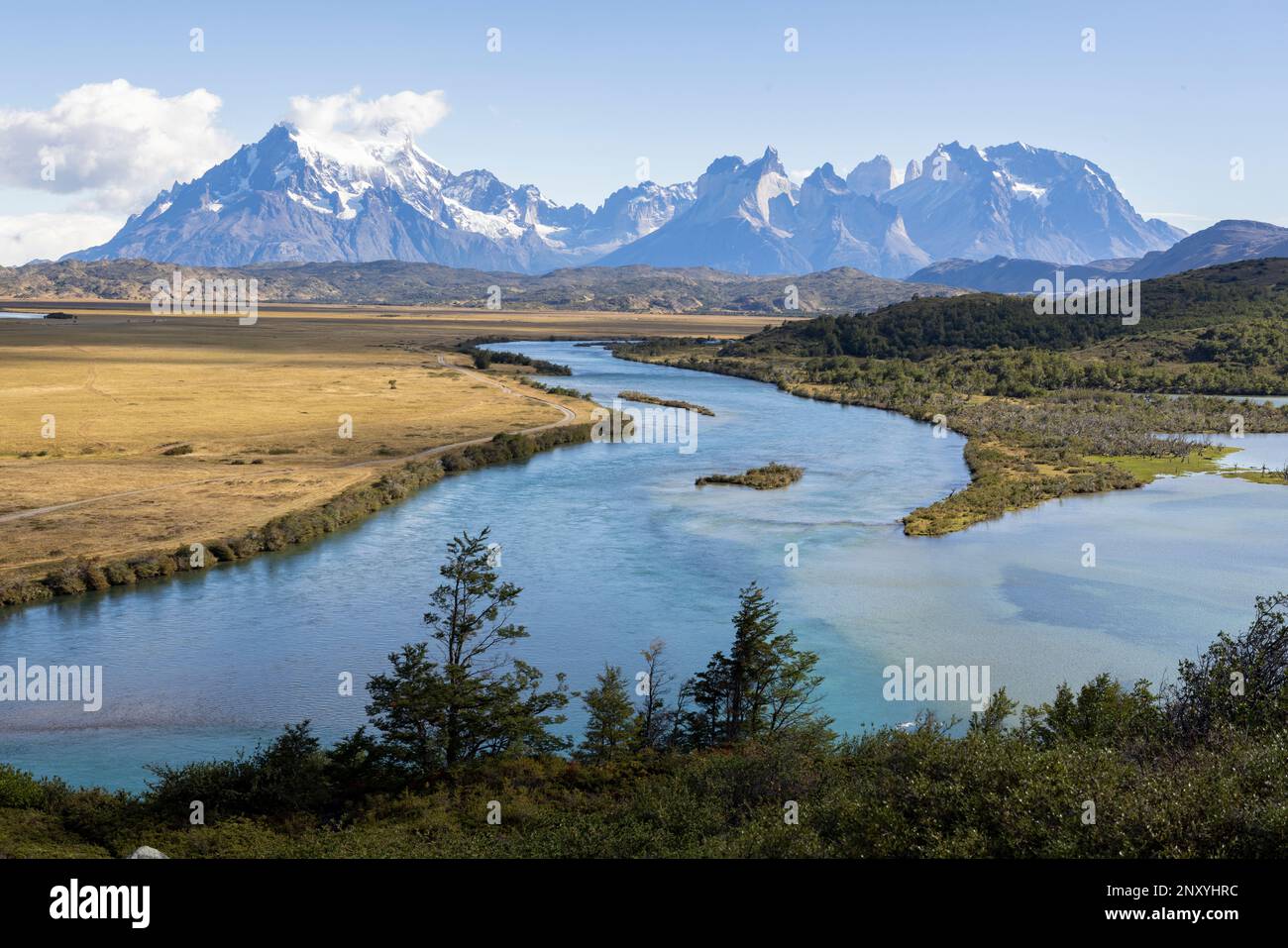 Serrano River, golden pampas and snowy mountains of Torres del Paine ...