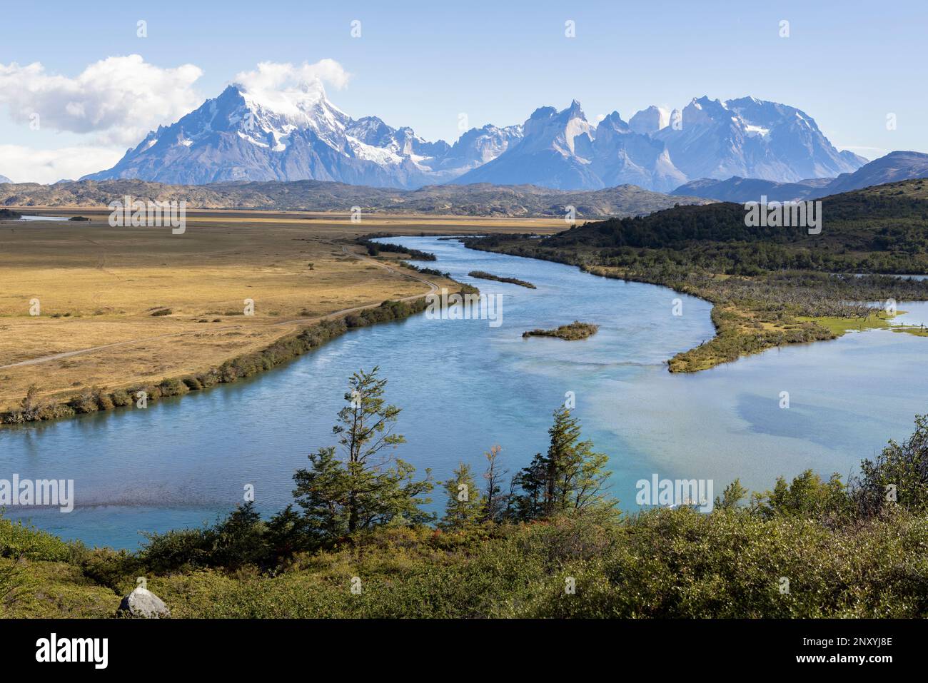 Serrano River, golden pampas and snowy mountains of Torres del Paine ...
