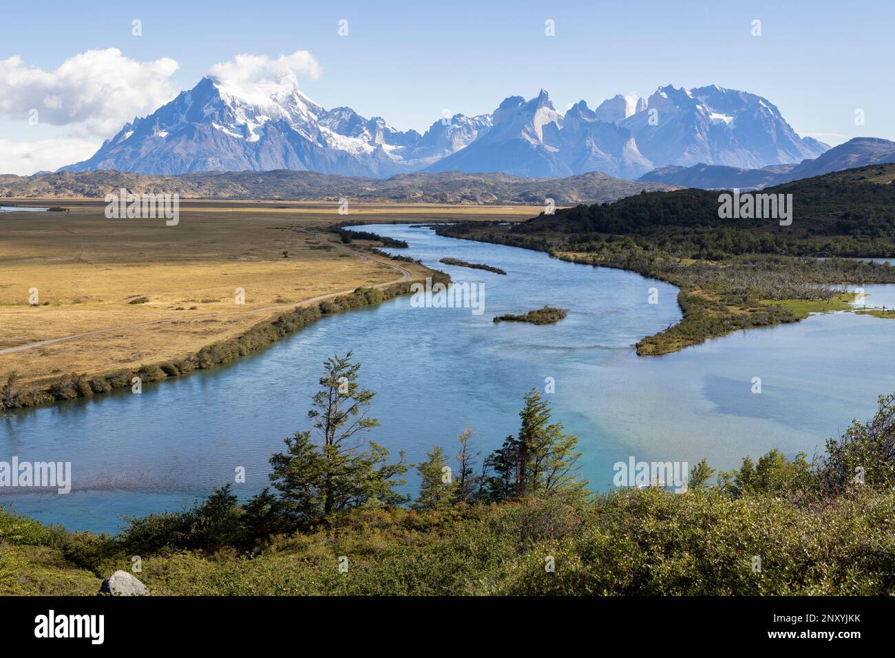 Serrano River, golden pampas and snowy mountains of Torres del Paine ...