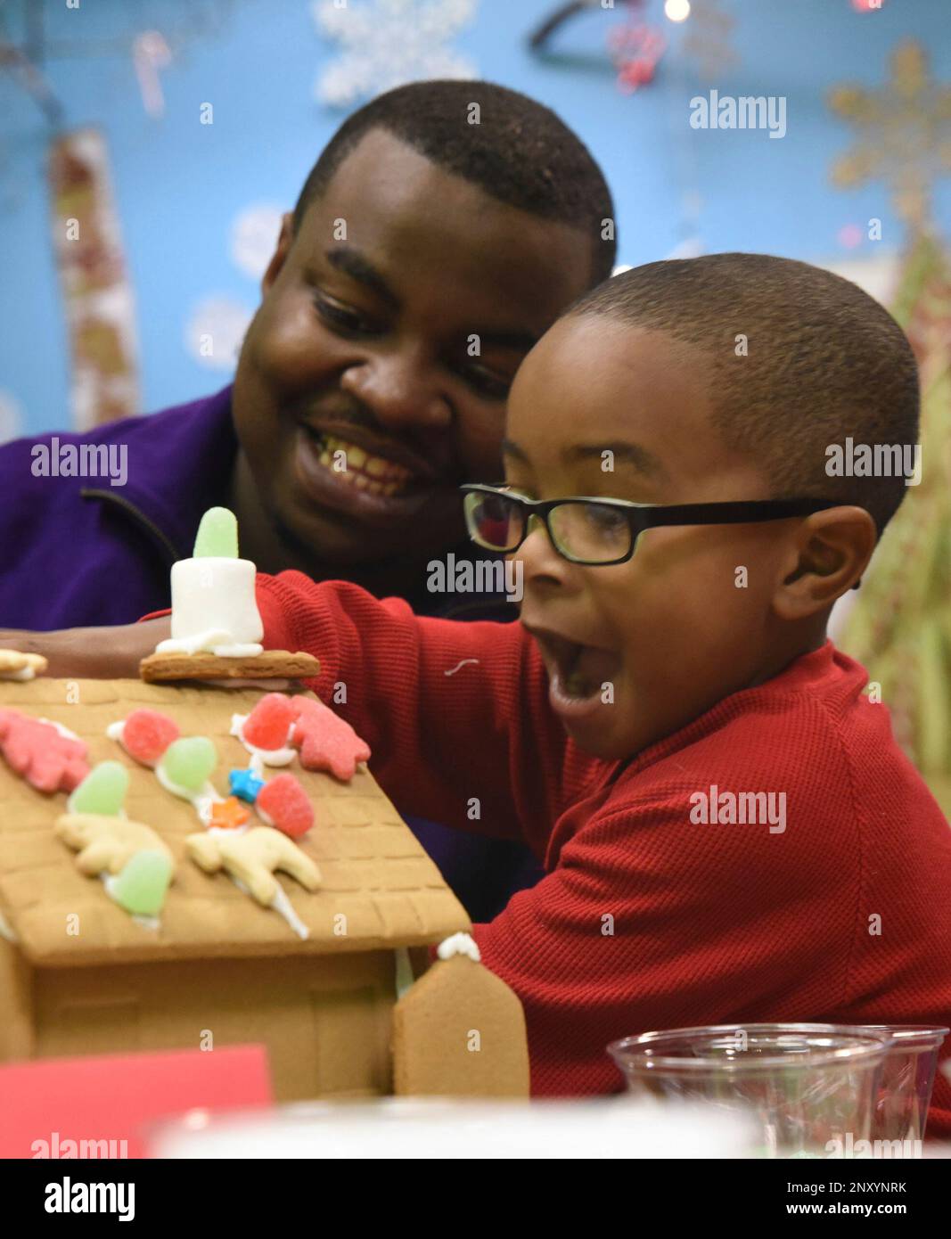 Tyrone Preston, left, and his son, Ajavian, 4, of South Pittsburg, get ...