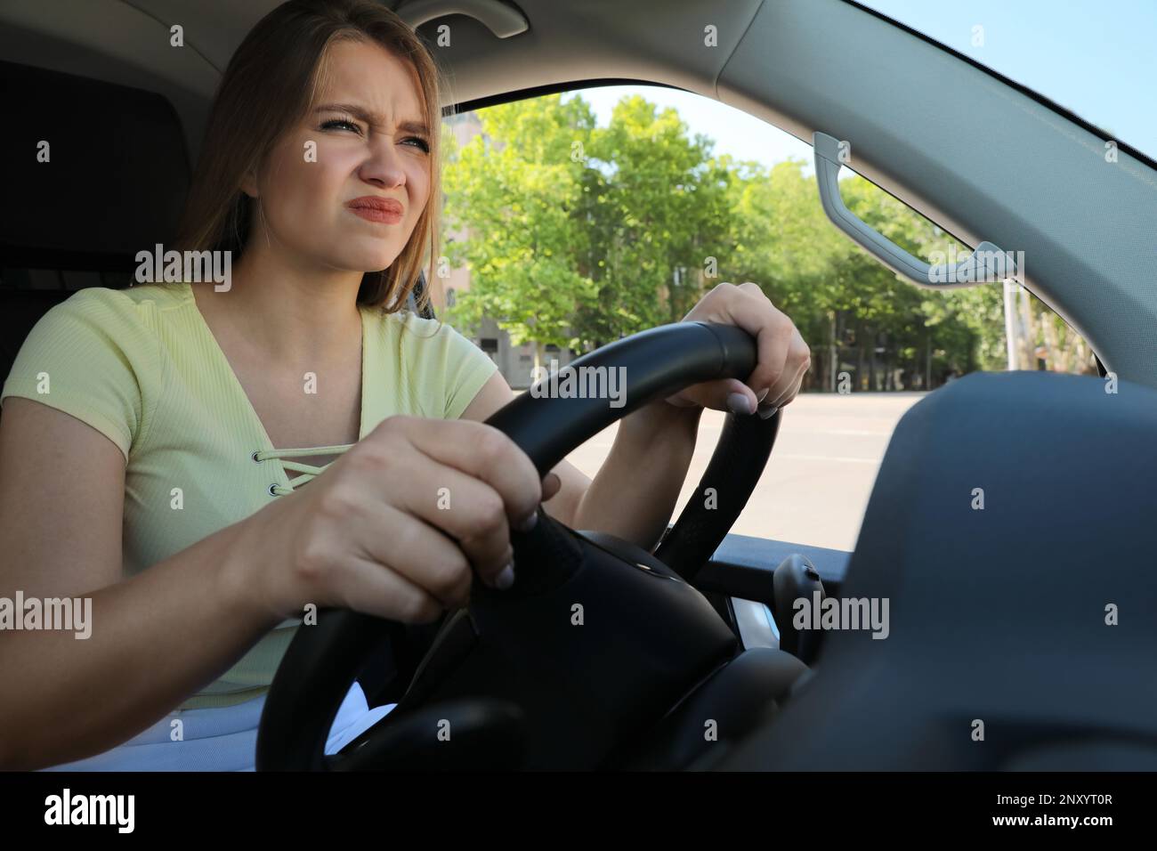 Emotional woman in car. Aggressive driving behavior Stock Photo - Alamy