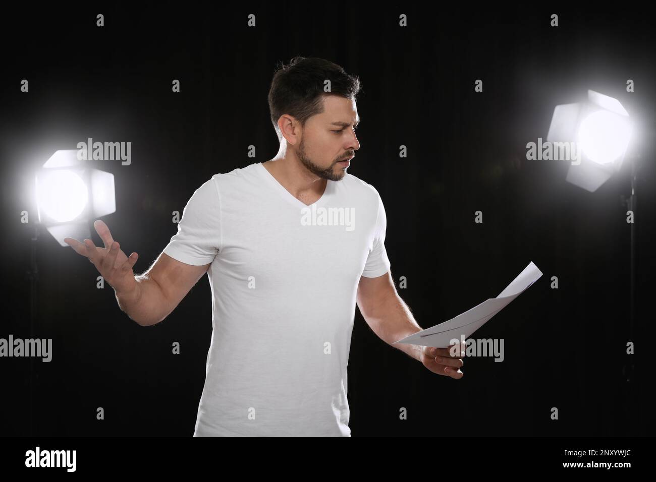 Professional actor reading his script during rehearsal in theatre Stock ...