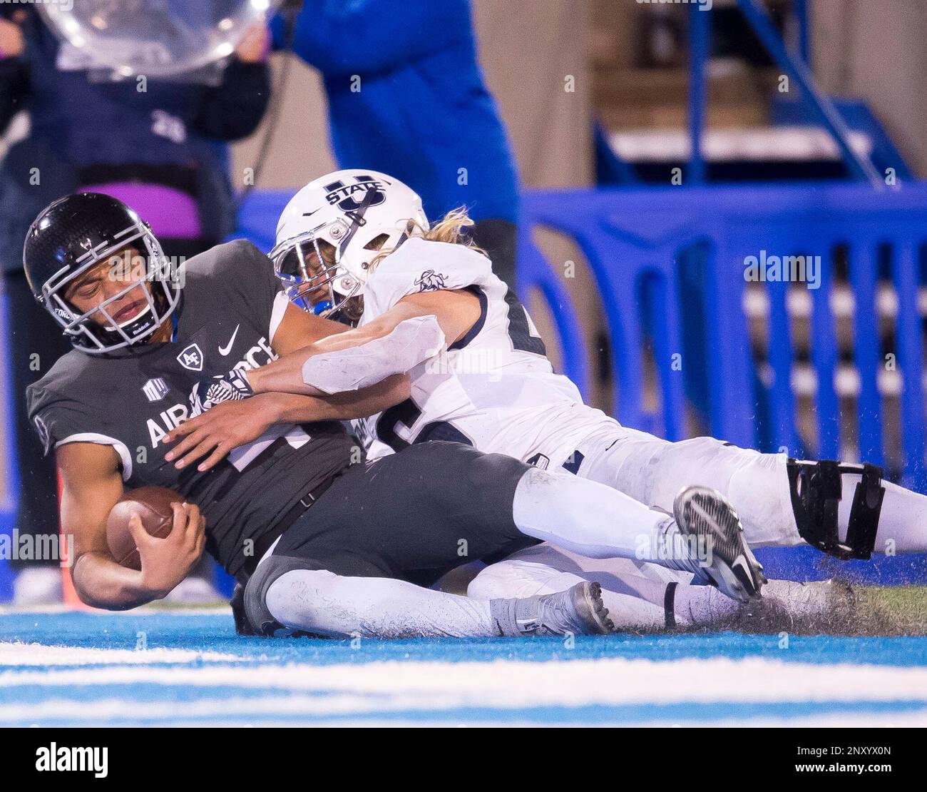 Air Force Quarterback Isaiah Sanders (4), left, successfully gets the ...