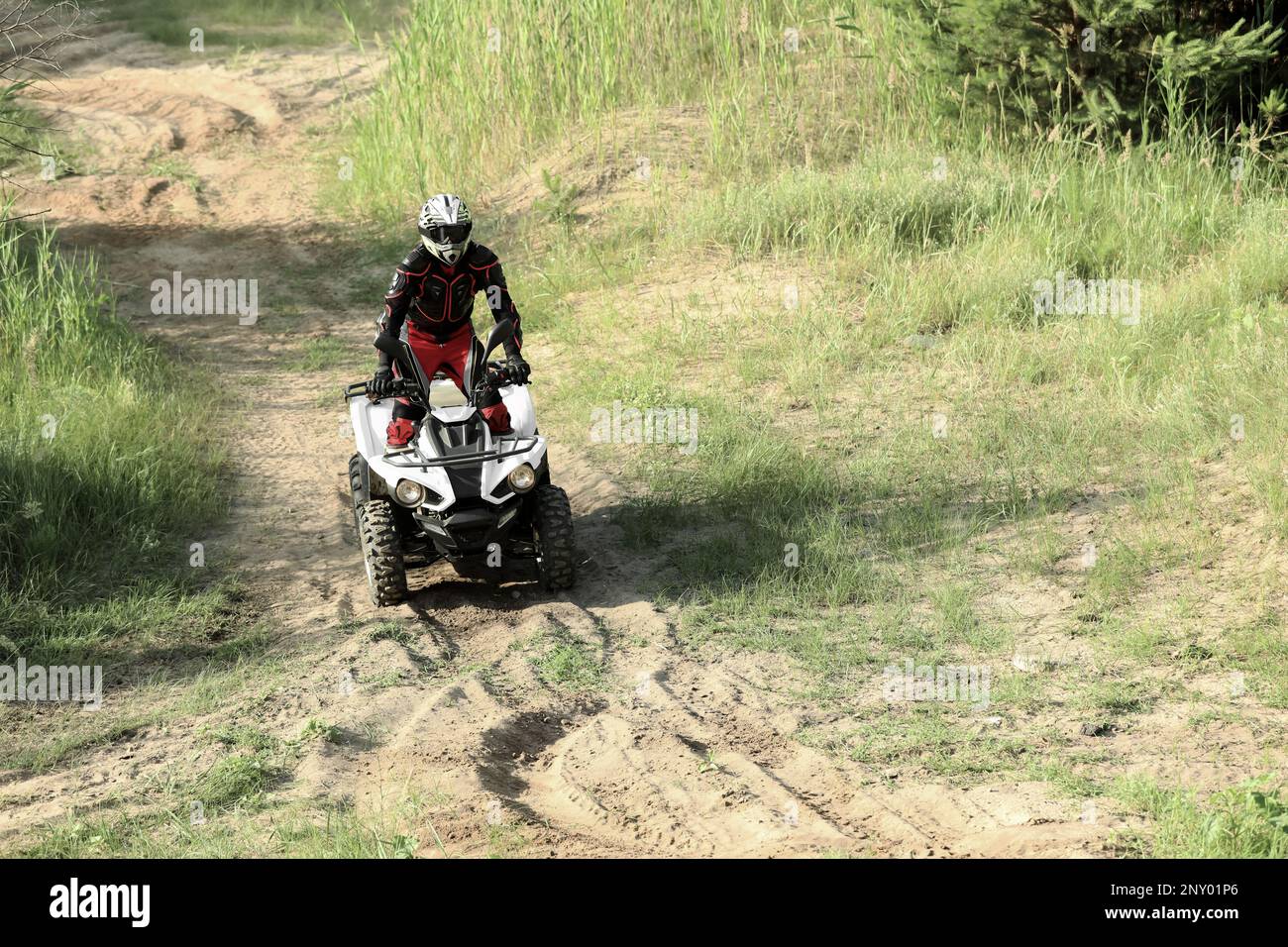 Man on quad with helmet hi-res stock photography and images - Alamy