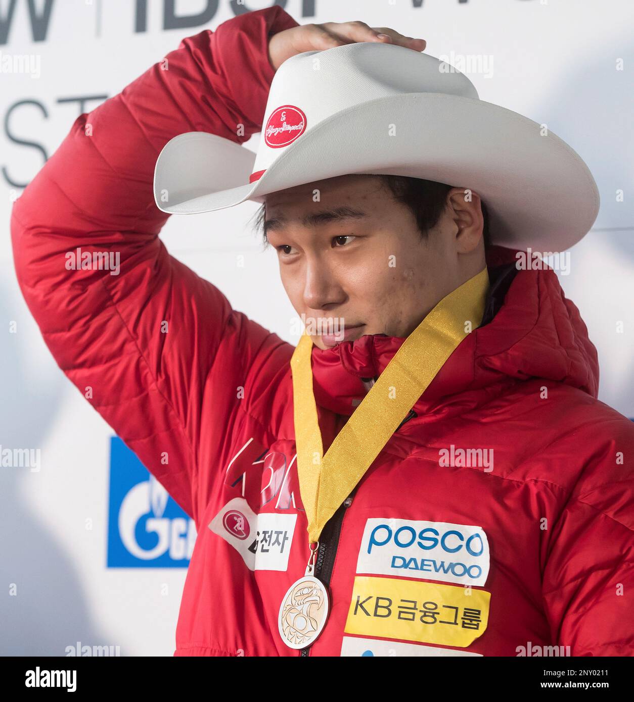 First-place finisher Sungbin Yun, of South Korea, puts on a cowboy hat ...