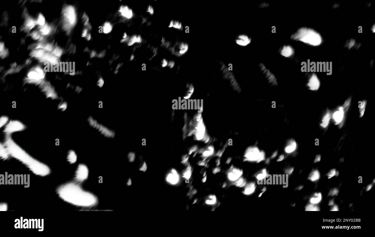 Shimmering white highlights on black background. Motion. White ...