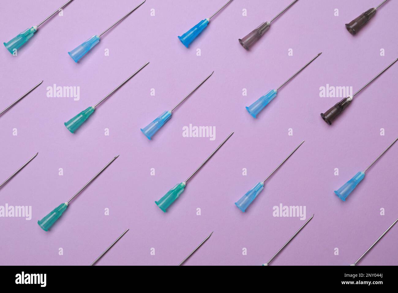 Disposable syringe needles on violet background, flat lay Stock Photo ...
