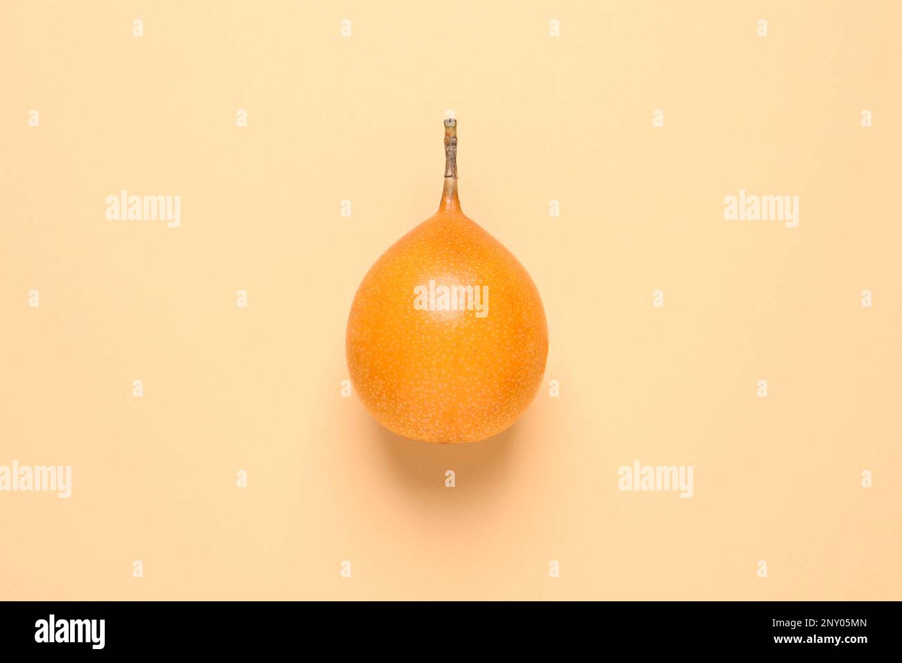 Delicious ripe granadilla on beige background. top view Stock Photo - Alamy