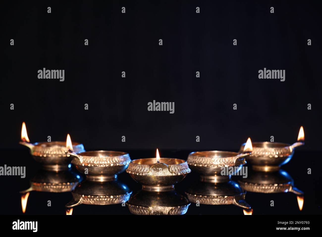 Many lit diyas on black background, space for text. Diwali lamps Stock ...