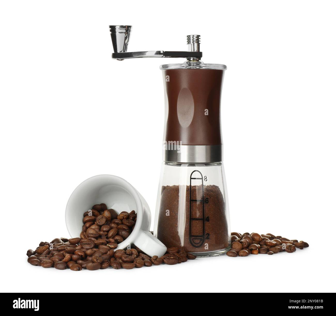 Modern manual coffee grinder with powder, beans and cup on white ...