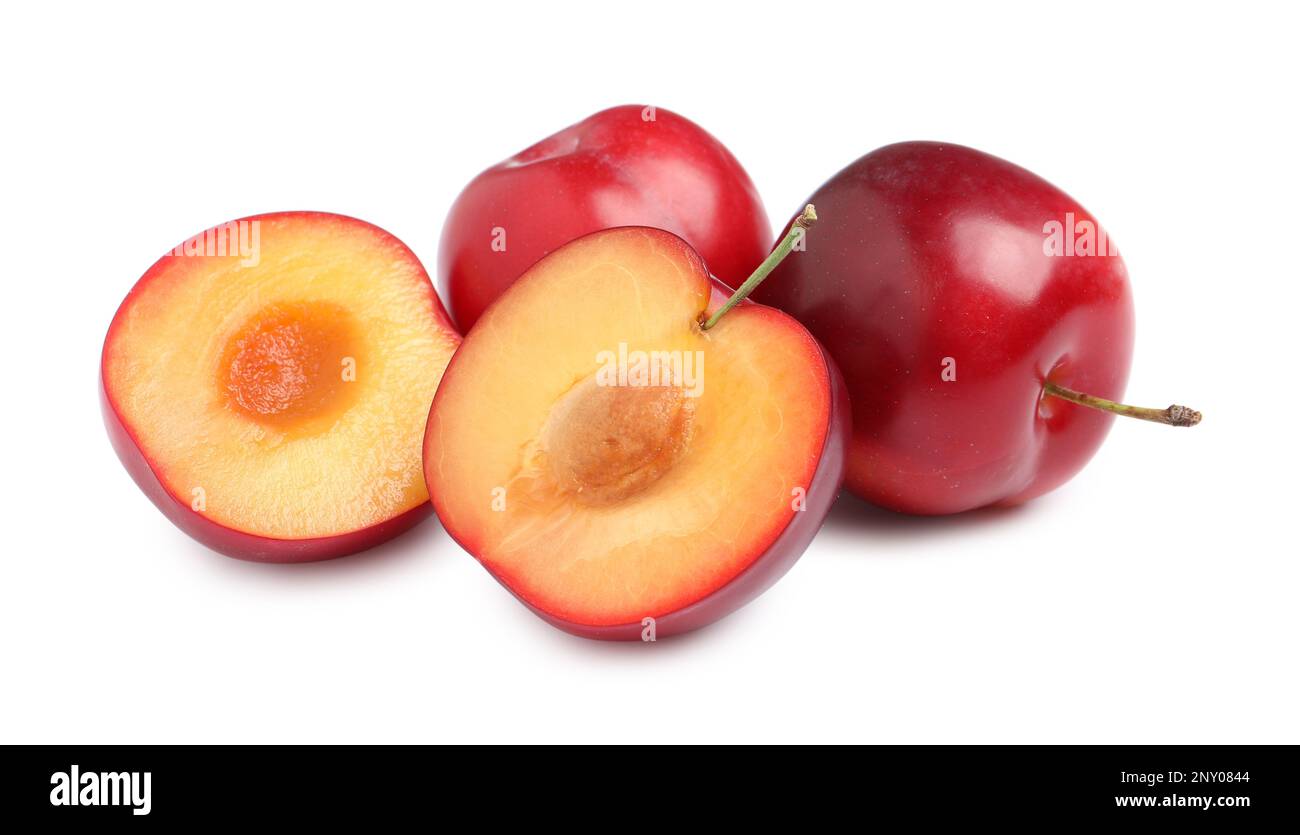 Cut and whole cherry plums on white background Stock Photo - Alamy