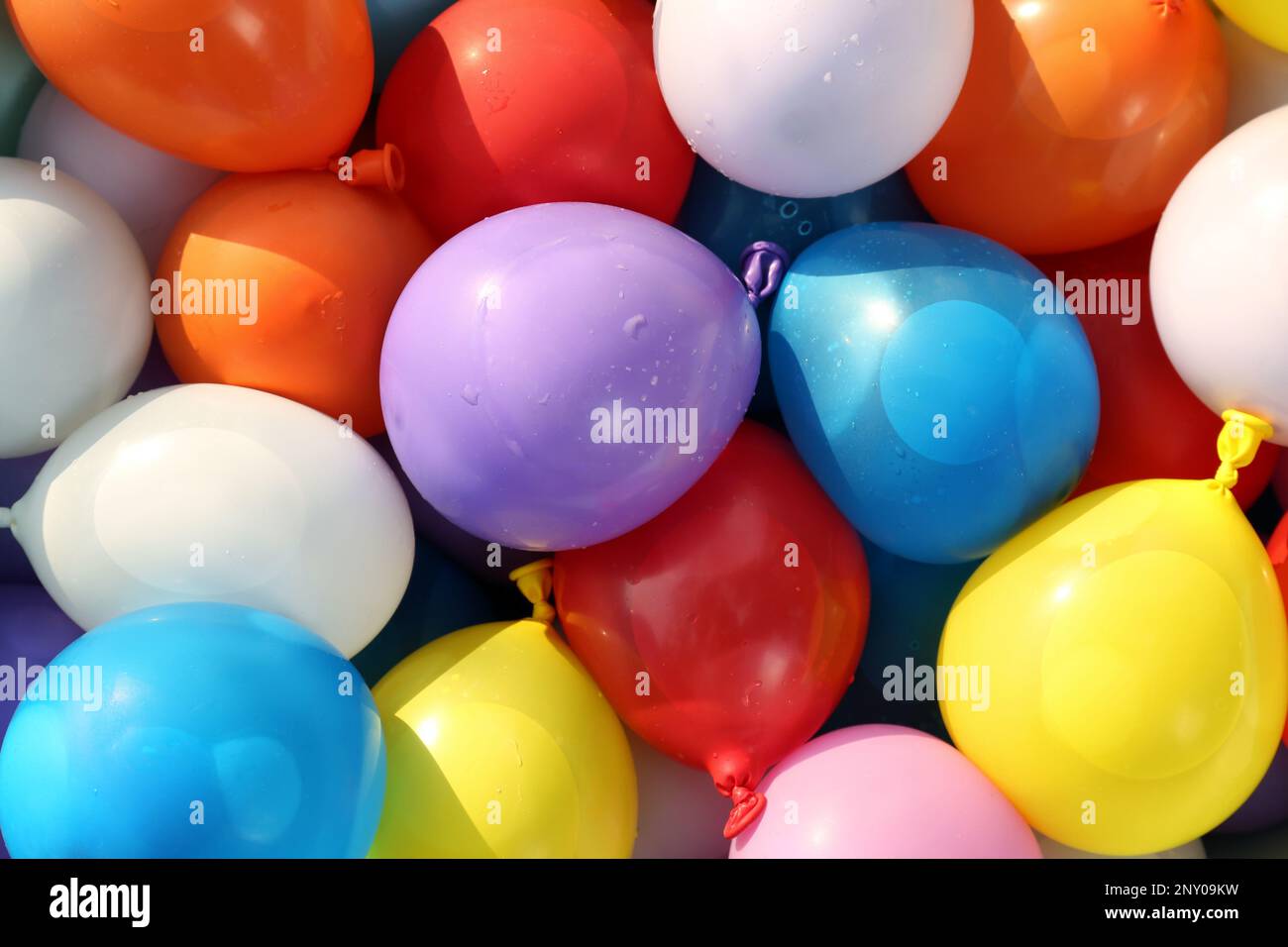 Top view of colorful water bombs background Stock Photo - Alamy