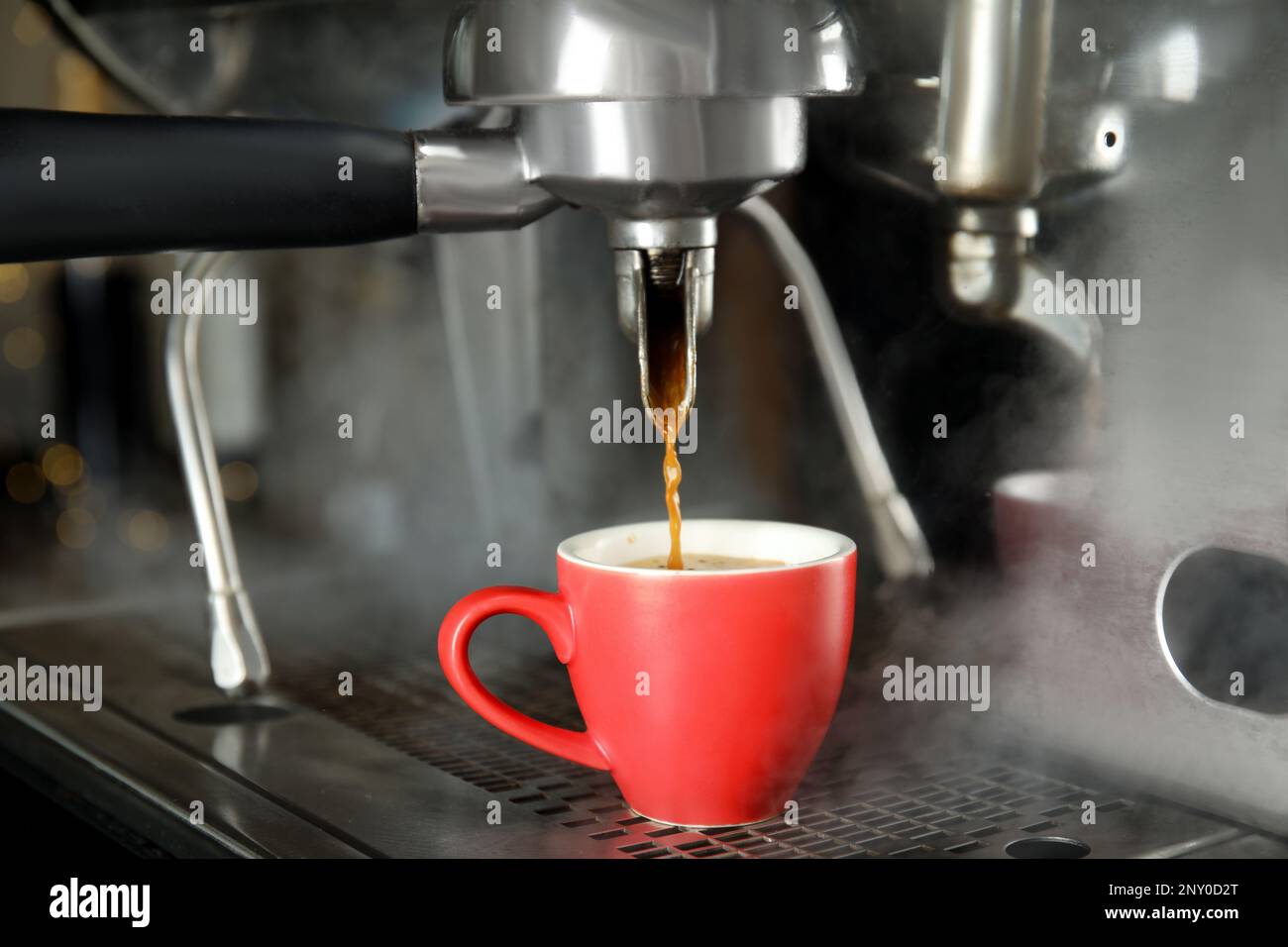 Making fresh aromatic espresso using professional coffee machine Stock ...
