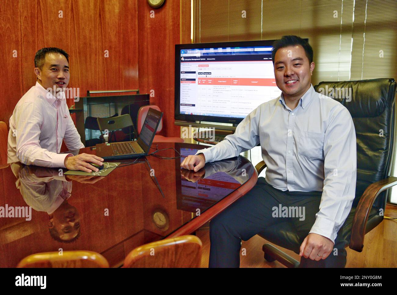 From left : Edwin Seah ,49, CEO , Enhanzcom Pte Ltd and Brian Wong De ...