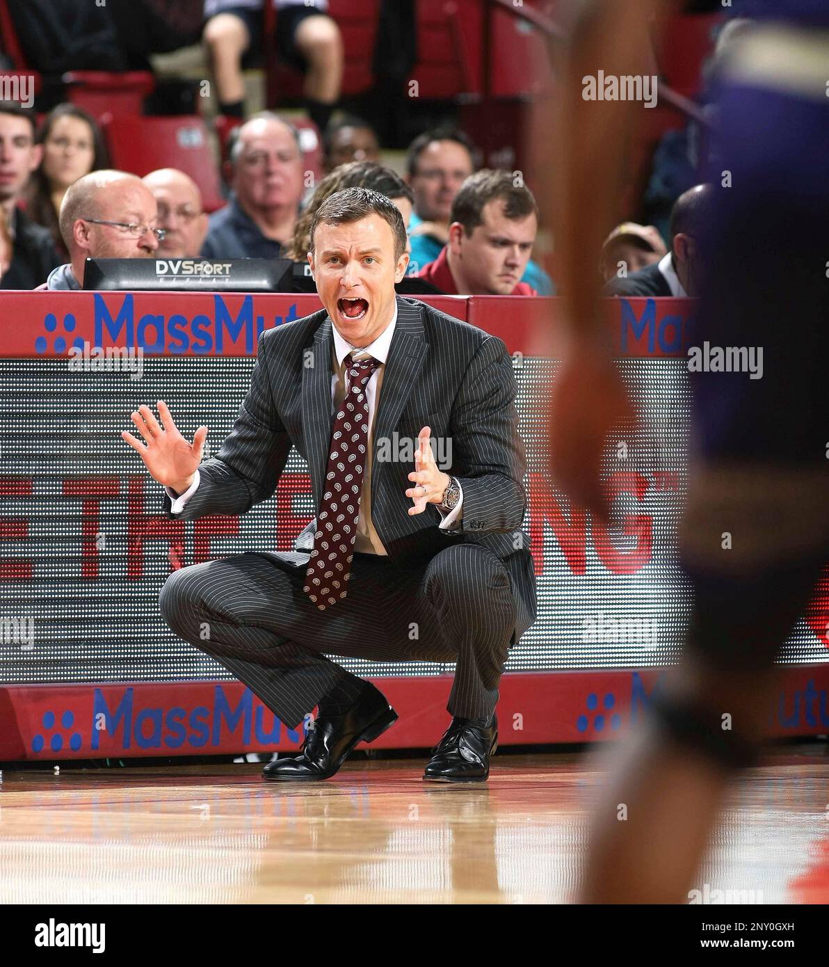 UMass Head Coach Matt McCall, yells out instructions to his players ...