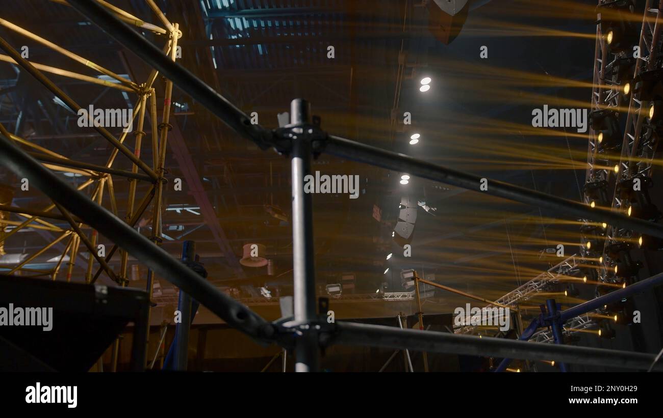 Construction of stage with glowing spotlights. Stock footage. Metal ...