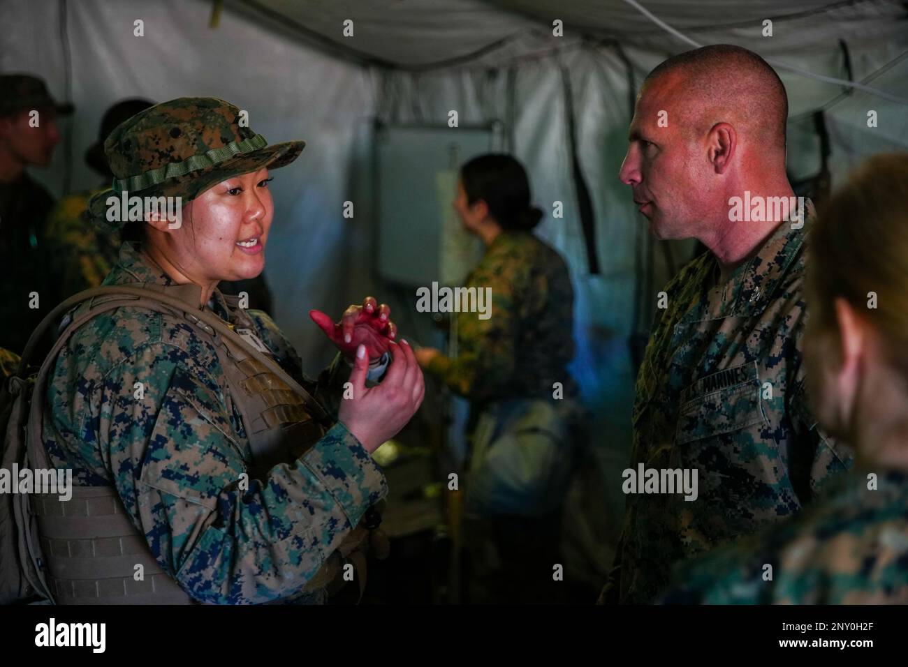 U.S. Navy Lt. Cmdr. Kelly Perry, left, an emergency medicine physician ...