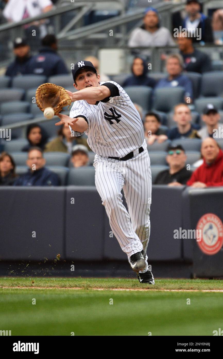 New York Yankees pitcher Bryan Mitchell (55) plays 1st base during game ...