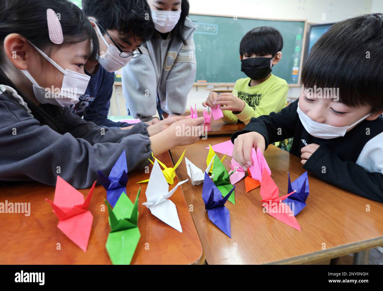 Elementary school students make a thousand folded-paper cranes to give ...