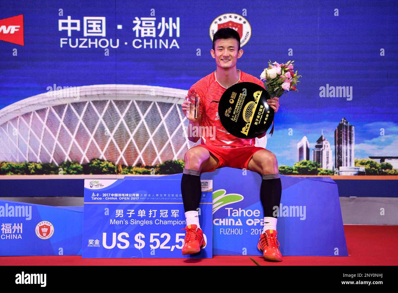 Chen Long of China poses with his trophy after defeating Viktor Axelsen ...