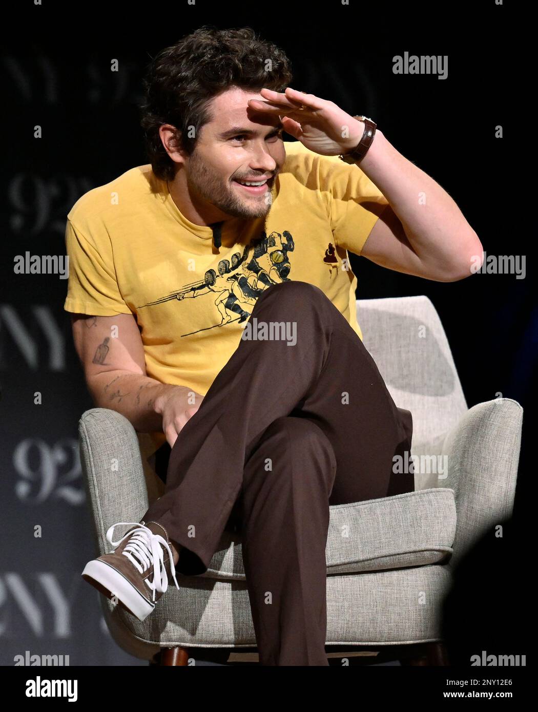 Actor Chase Stokes gestures while speaking on stage about the Netflix ...