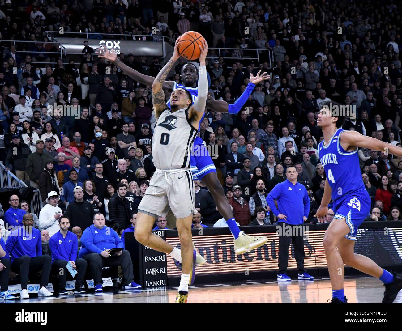 Providence guard Alyn Breed (0) scores during the first half of the ...