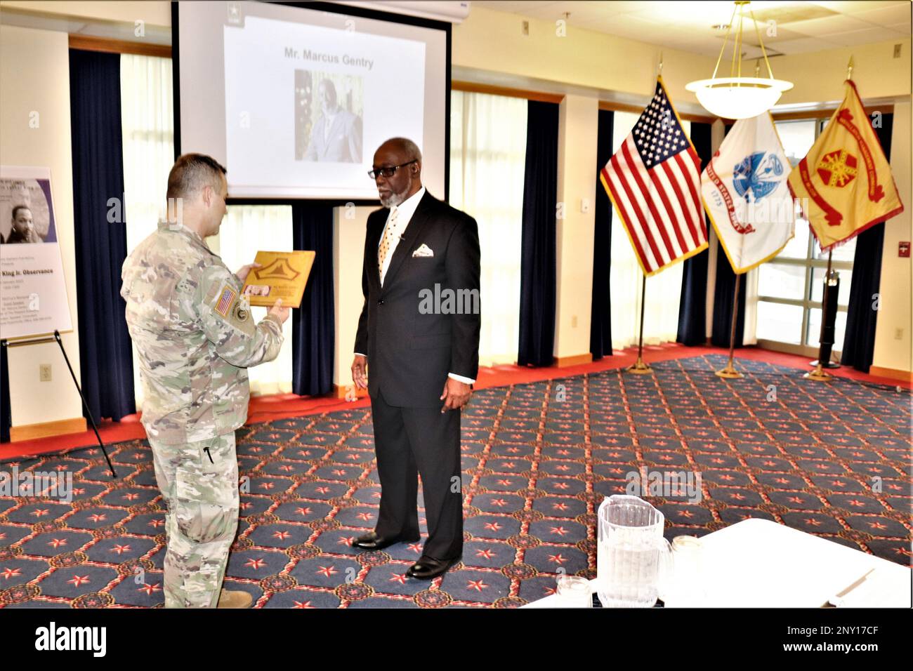 Guest speaker Marcus Gentry receives a special appreciation plaque from ...