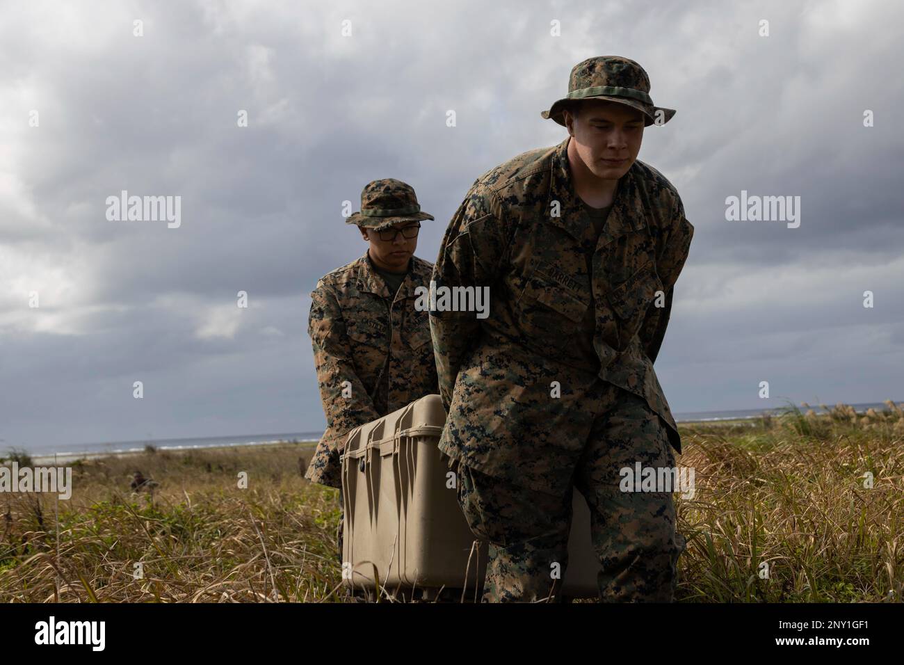 U.S. Marine Corps Lance Cpl. William Barrett, front, a water support ...