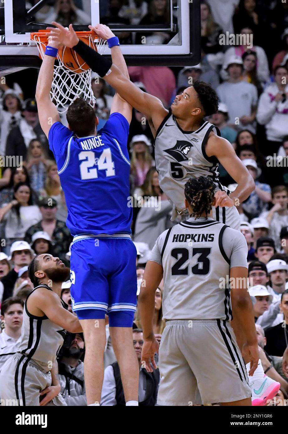 Xavier forward Jack Nunge (24) dunks as Providence forward Ed Croswell ...