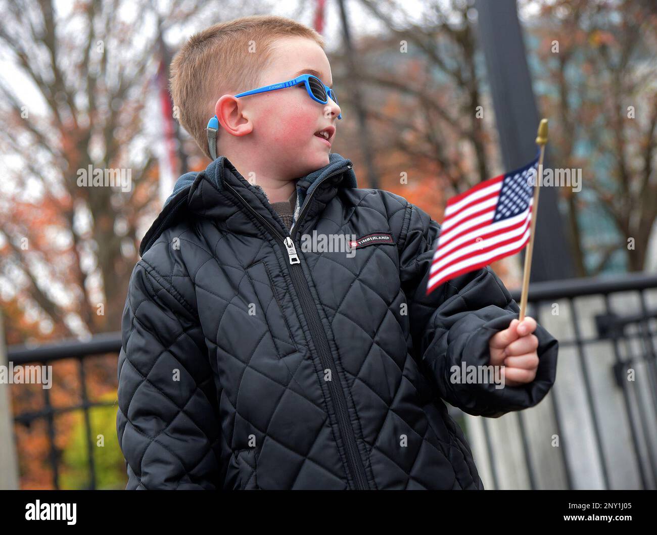 Five-year-old Clayton Wallace Britt waves an American flag as he ...