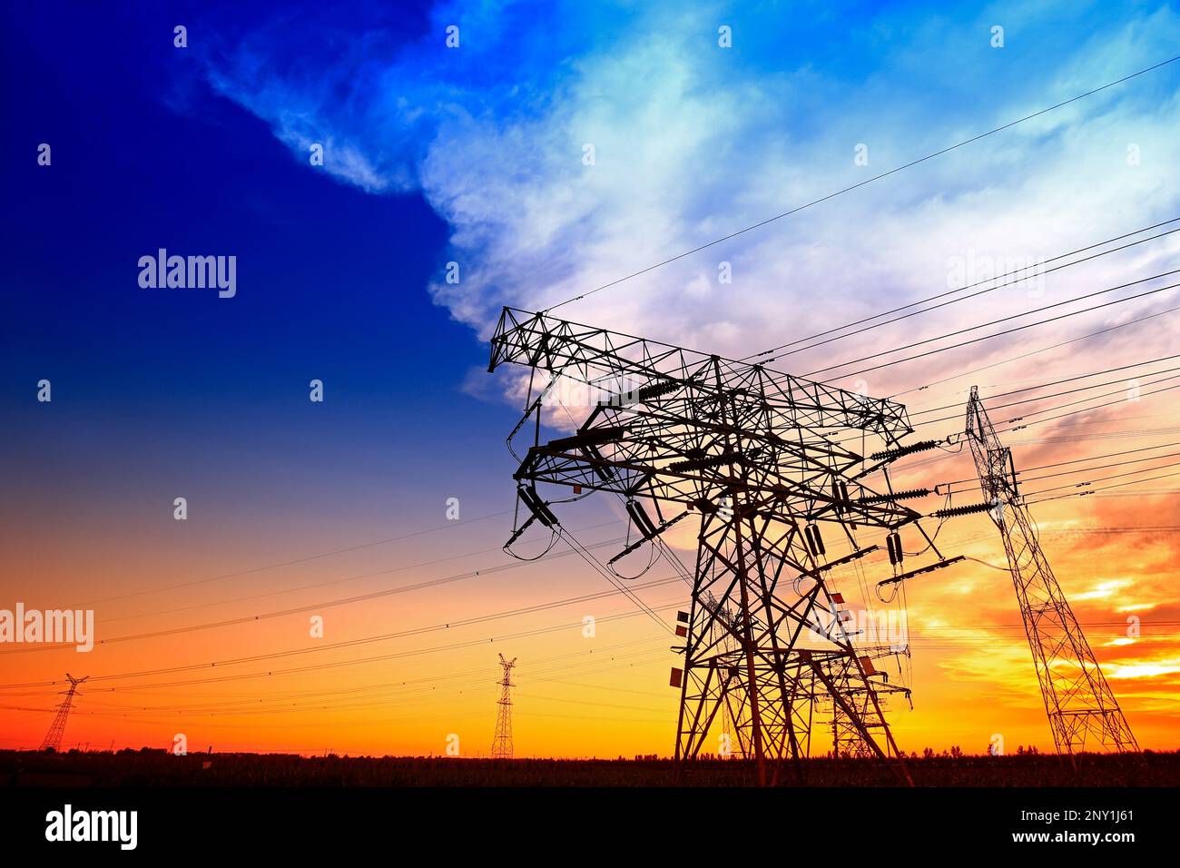 Pylon, high-voltage tower sky background Stock Photo - Alamy