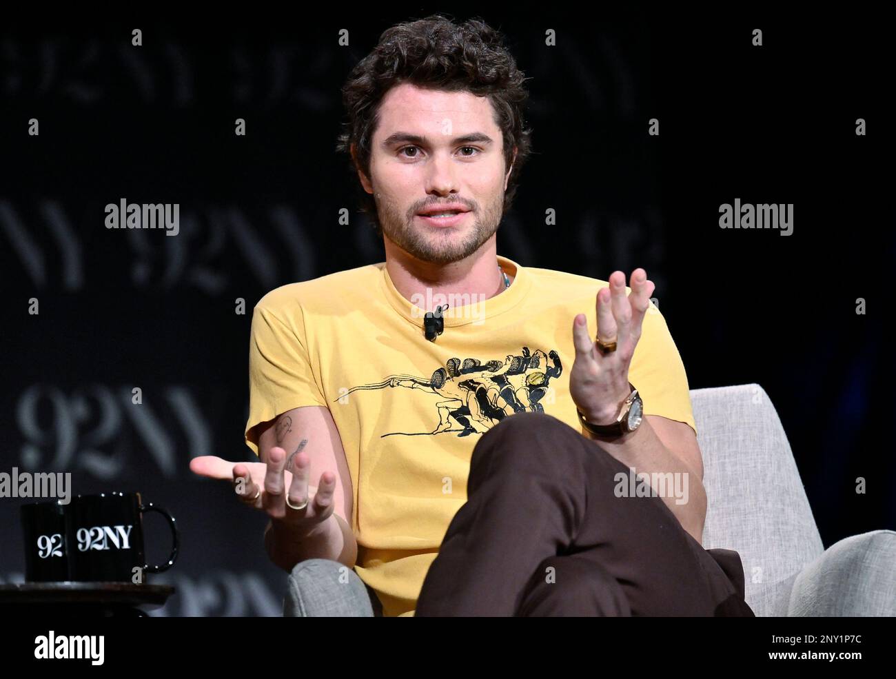 Actor Chase Stokes speaking on stage about the Netflix television ...